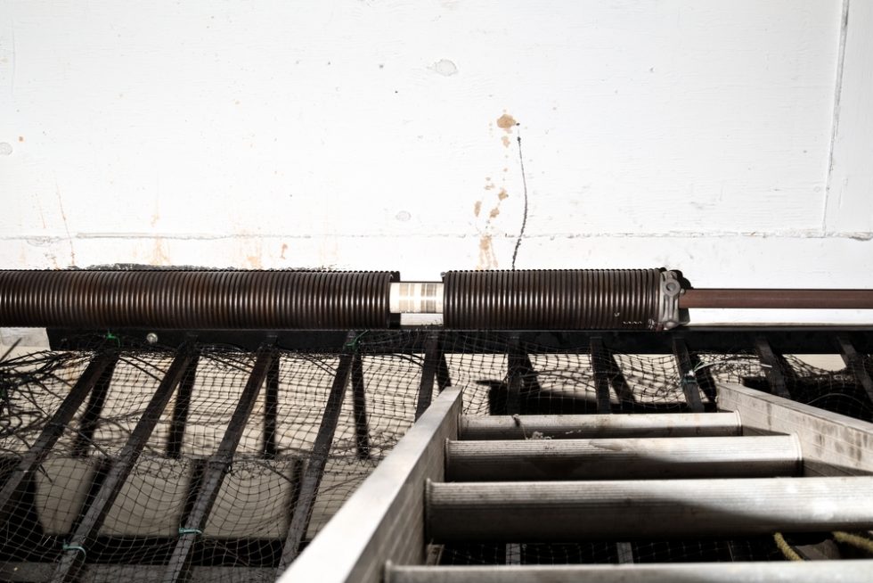 Broken Torsion Spring? Signs, Causes, & Repair Options